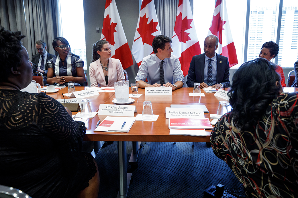 Prime Minister Justin Trudeau speaks with members of the Canadian Black ...