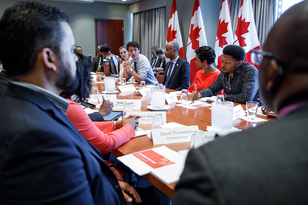 Prime Minister Justin Trudeau speaks with members of the Canadian Black ...