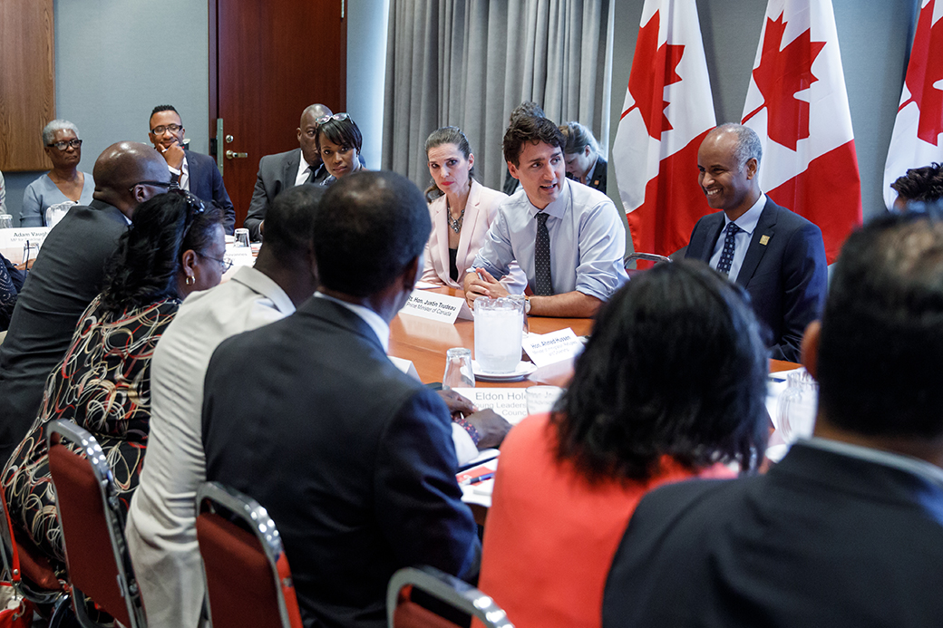 Prime Minister Justin Trudeau speaks with members of the Canadian Black ...