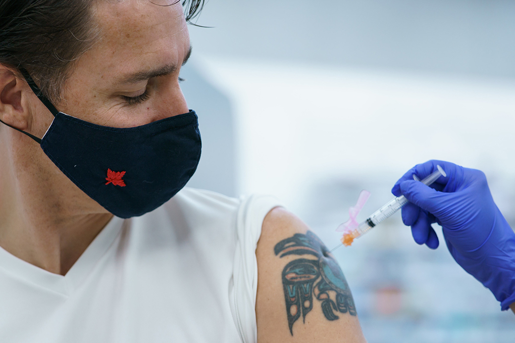 Prime Minister Justin Trudeau receives the Moderna COVID-19 vaccine for ...