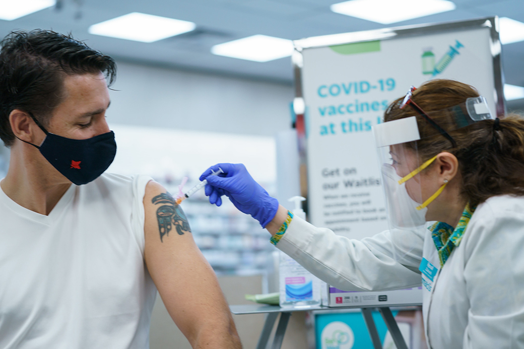 Prime Minister Justin Trudeau receives the Moderna COVID-19 vaccine for ...