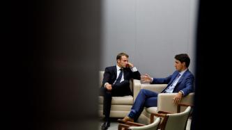 Prime Minister Justin Trudeau speaks with the President of France ...