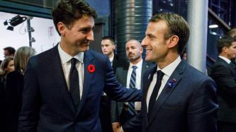 Prime Minister Justin Trudeau speaks with the President of France ...